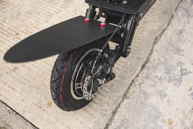 The Rear Fender of a Small Electric Scooter Parked by the Side of the ...