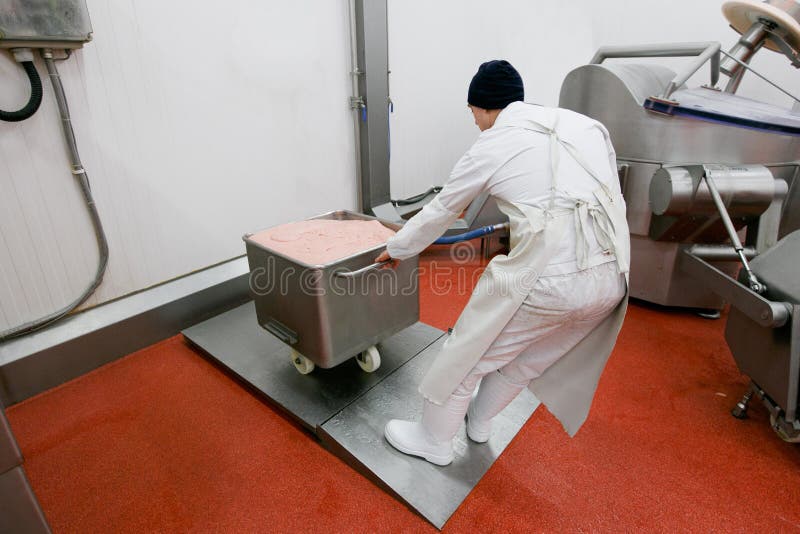 Rear Image of a Worker Pulling Crates of Meat at a Meat Processing ...