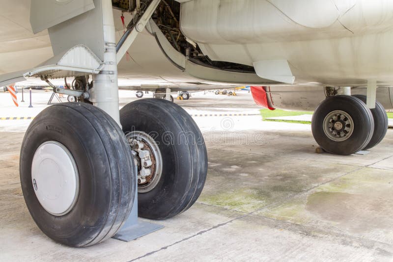 Rear Landing Gear and Engine Passenger Plane on the Ground Stock Image ...