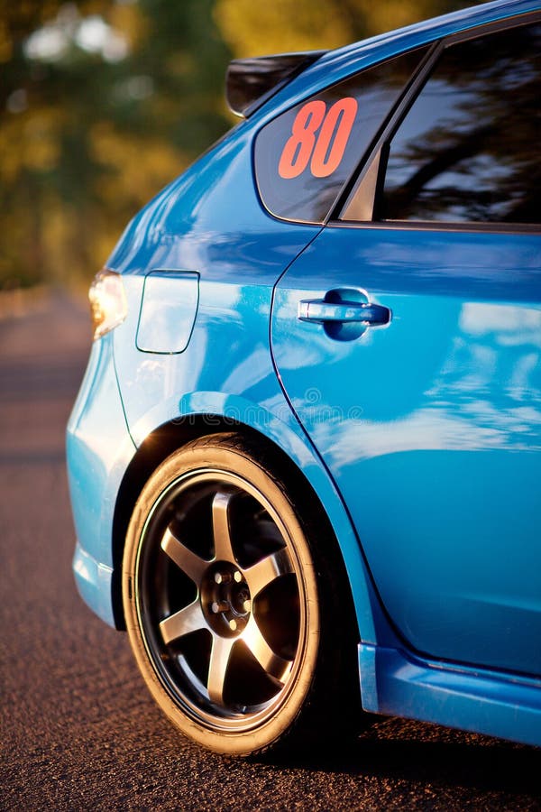 Rear Side View of Blue Sport Car Stock Photo - Image of land, outdoors ...