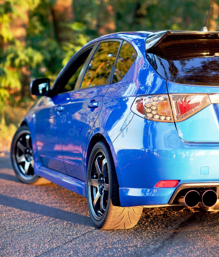 Rear Side View of Blue Sport Car Stock Photo - Image of land, metal ...