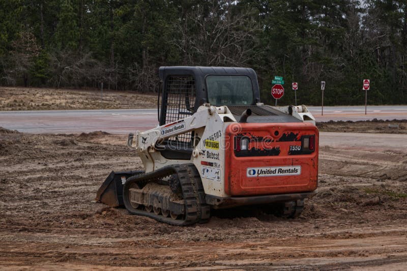 Rear of Bobcat Skid Steer Loader Stock Photo - Image of beige, bobcat ...