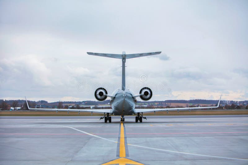 Rear View of Airplane in Airport Stock Image - Image of engine, flare ...