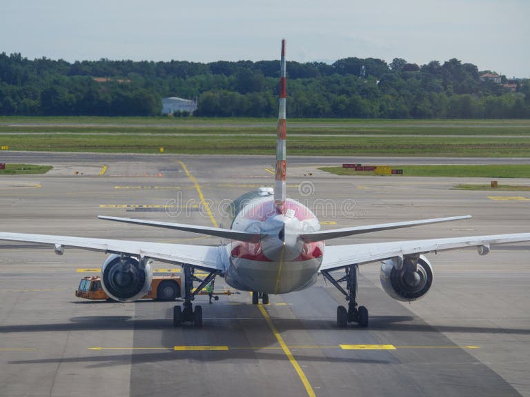Rear View of an Airplane in Motion on the Runway Stock Photo - Image of ...