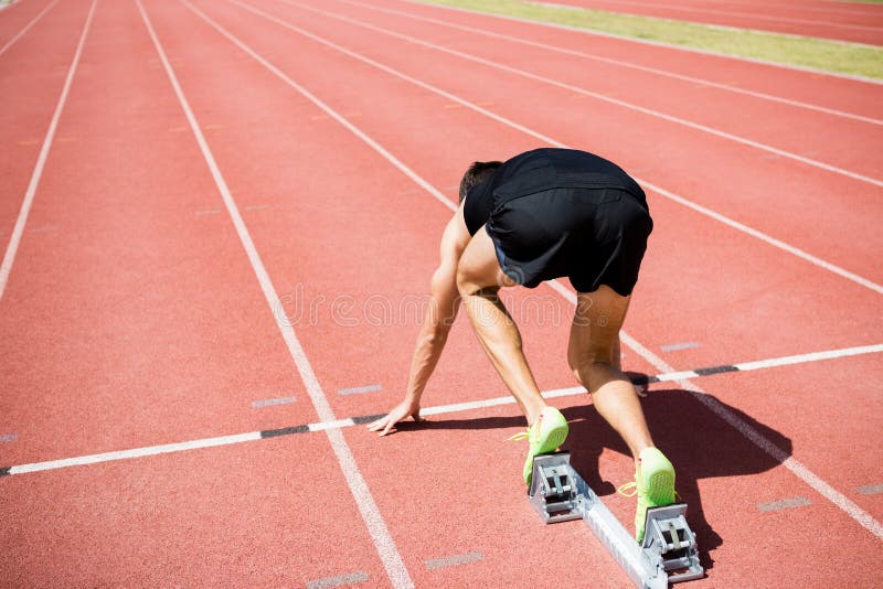 Rear View of an Athlete Ready To Run Stock Image - Image of focused ...