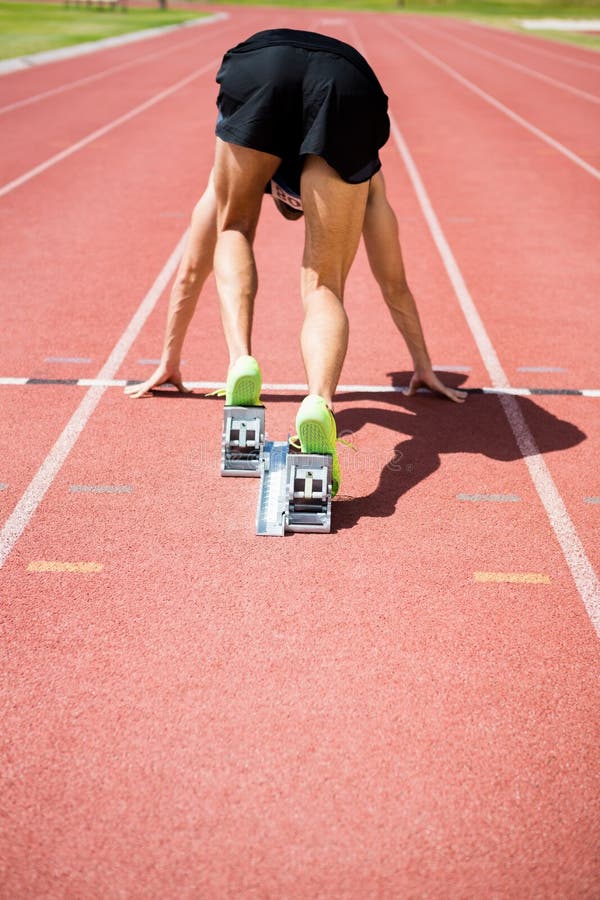 Rear View of an Athlete Ready To Run Stock Photo - Image of position ...
