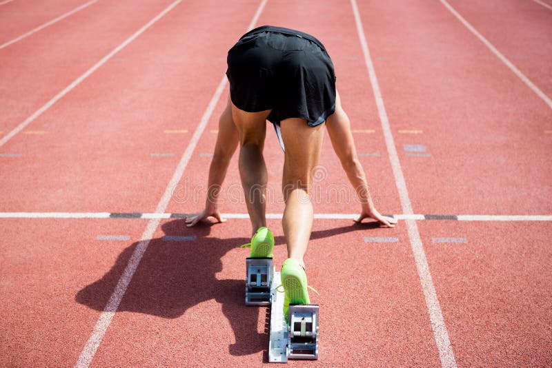 Rear View of an Athlete Ready To Run Stock Image - Image of athletic ...