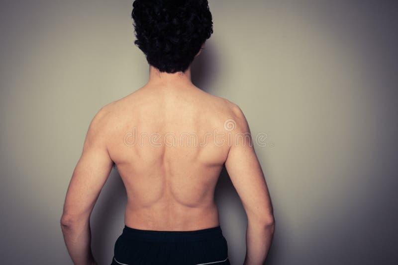 Rear View of Athletic Young Man Stock Photo - Image of muscle, exercise ...