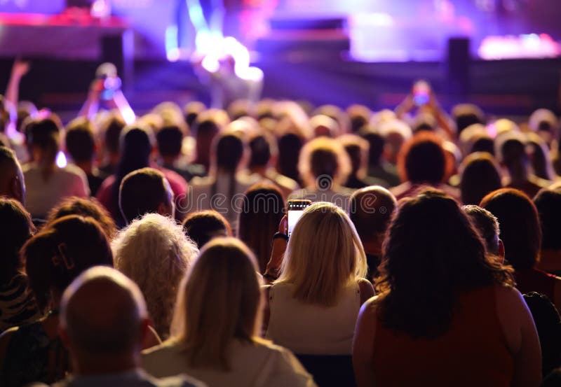 Rear View of the Audience with Their Heads Turned Stock Photo - Image ...