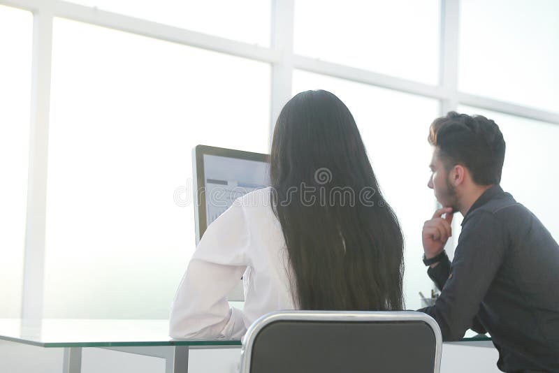 Rear View.business Couple Sitting at a Desktop Computer Stock Image ...