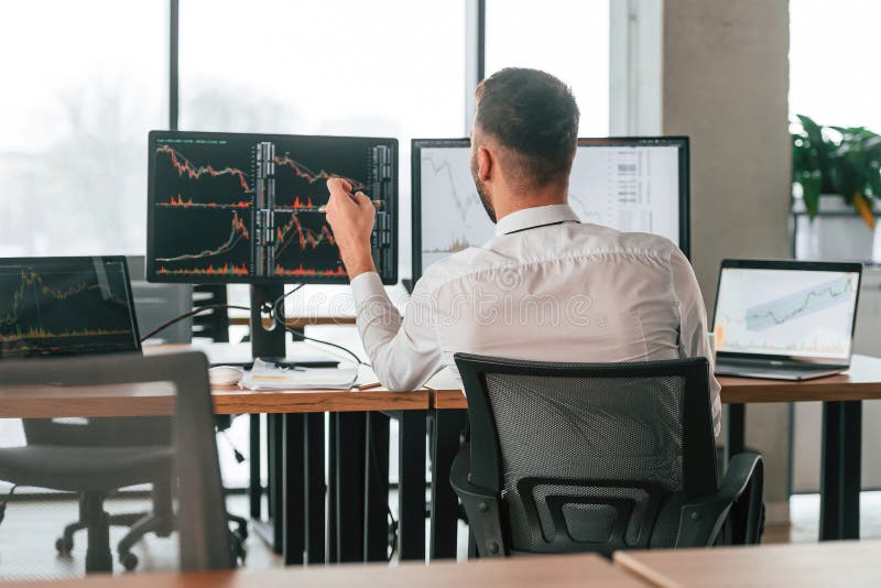 Rear View. Businessman is Sitting by Computer and Working in the Office ...