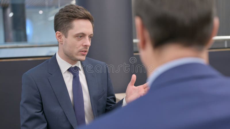 Rear View of Businessman Talking To Man in Office Stock Image - Image ... Rear View of Businessman Talking To Man in Office Stock Image - Image ...