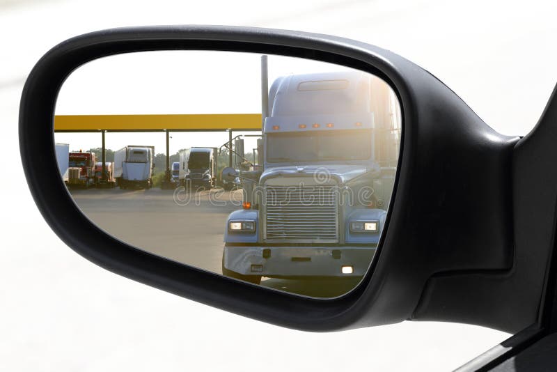 Rear View Car Driving Mirror Overtaking Big Truck Stock Image - Image ...