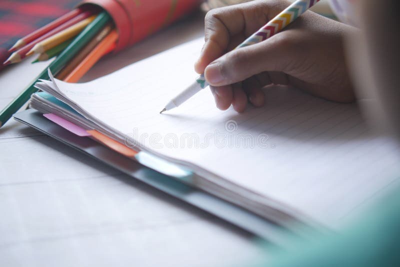 Rear View of Child Boy Hand Writing on Notepad. Stock Image - Image of ...
