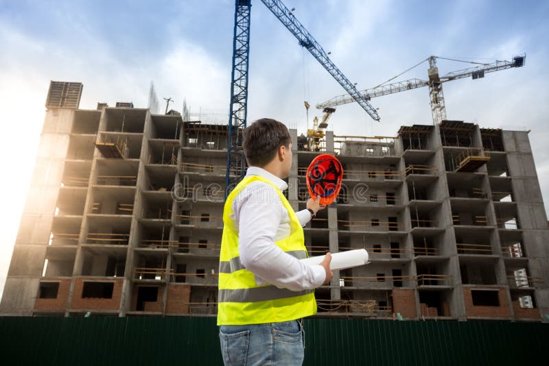 Rear View of Construction Engineer Posing on Building Site at Sunny Sky ...