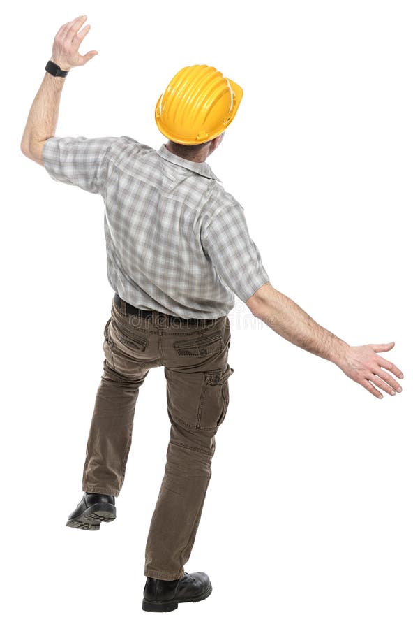 Rear View of a Construction Worker Balancing and Reaching Out with ...
