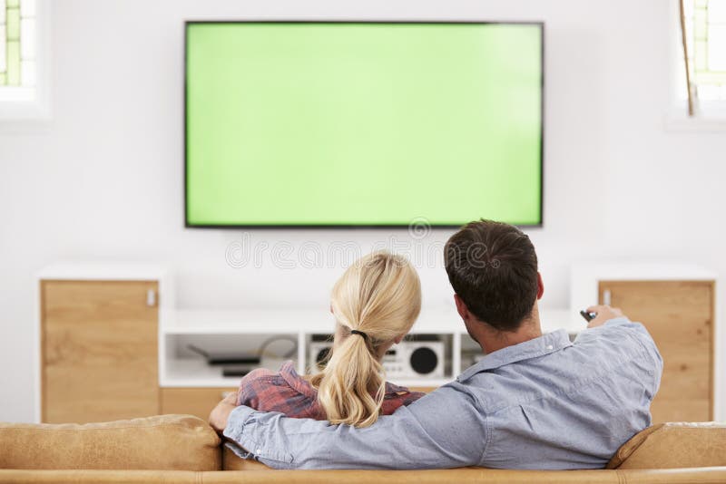 Rear View of Couple Watching Television Together Stock Photo - Image of ...