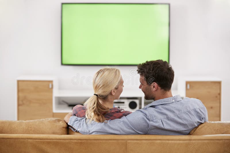 Rear View of Couple Watching Television Together Stock Photo - Image of ...