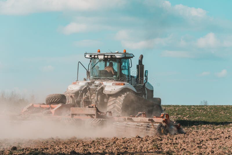 Rear View of a Crawler Tractor during Sowing. Harrowing Soil in the ...