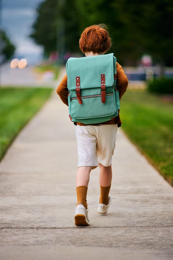 Rear View of Cute Redhead School Boy, Kid with Backpack Walks on the ...