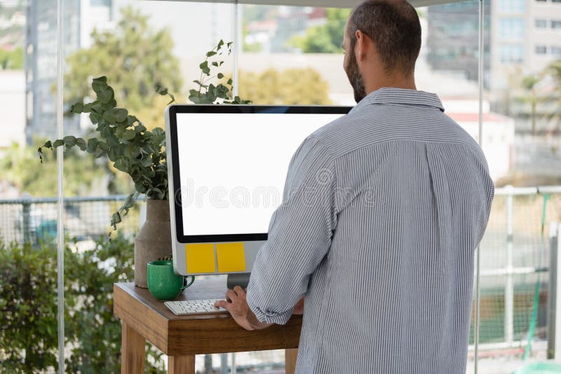 Rear View of Designer Using Computer in Office Stock Image - Image of ...