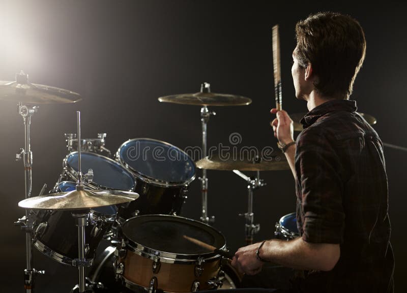 Rear View of Drummer Playing Drum Kit in Studio Stock Photo - Image of ...