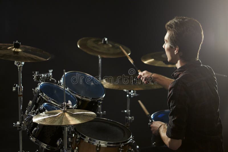 Rear View of Drummer Playing Drum Kit in Studio Stock Photo - Image of ...
