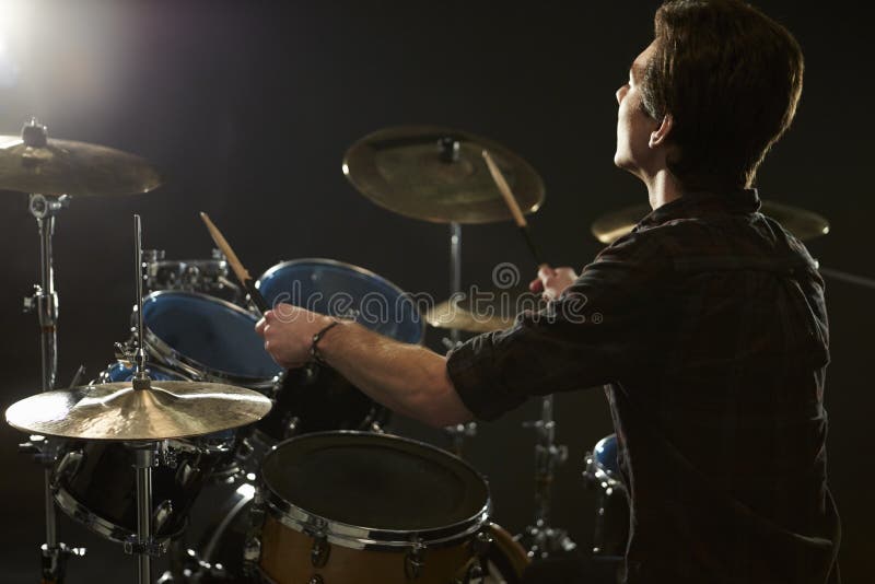 Rear View of Drummer Playing Drum Kit in Studio Stock Photo - Image of ...