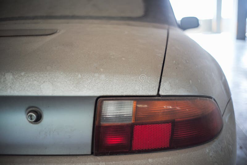 Rear View of Dusty Old Car with Indicator Light Abandoned in the ...