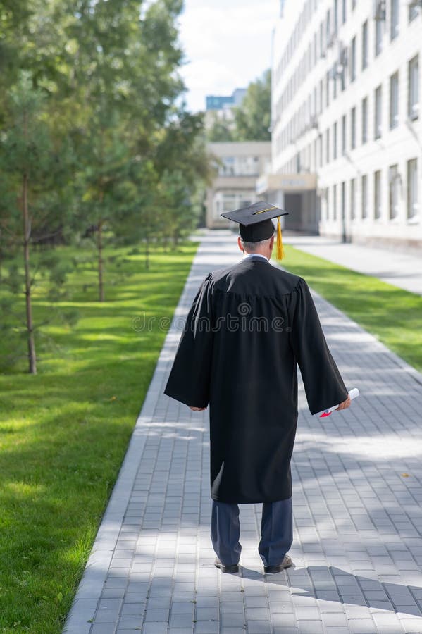 Rear View of an Elderly Man in a Graduation Gown. Stock Photo - Image ...