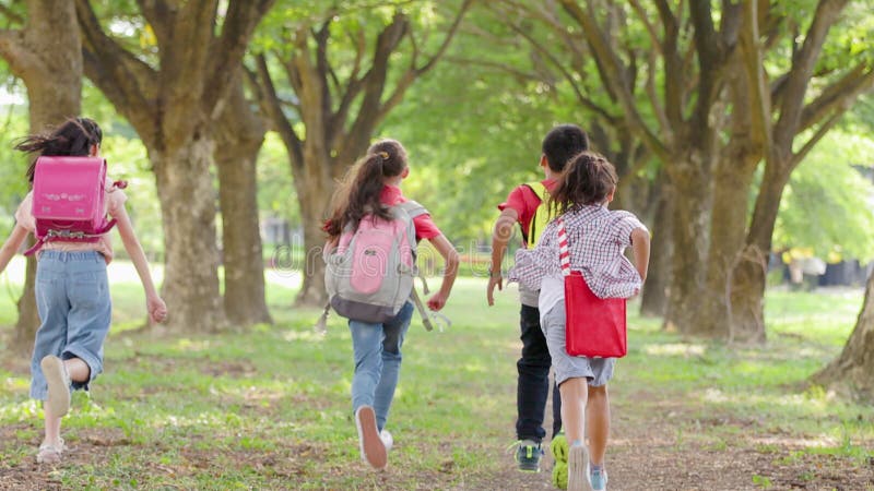 Rear View Elementary School Kids Running at School. Back To School ...