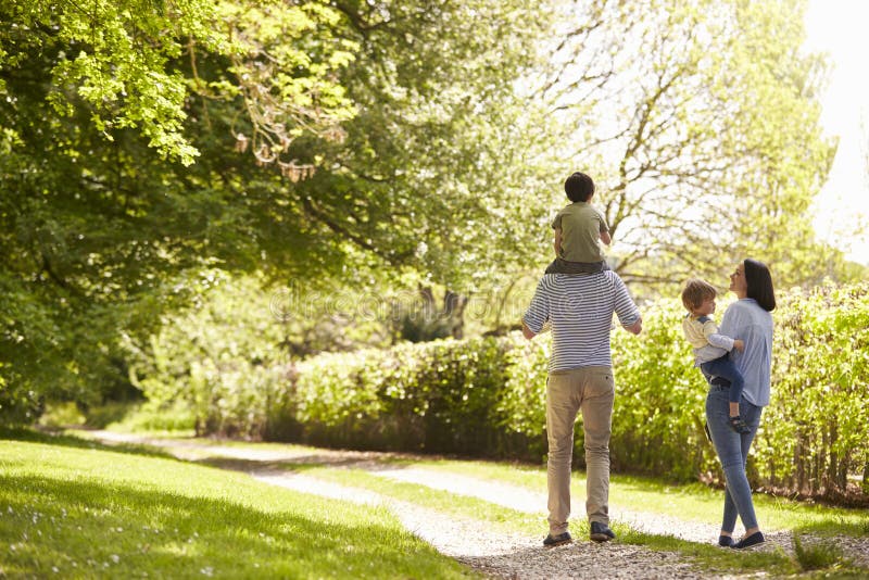 Rear View of Family Going for Walk in Summer Countryside Stock Image ...