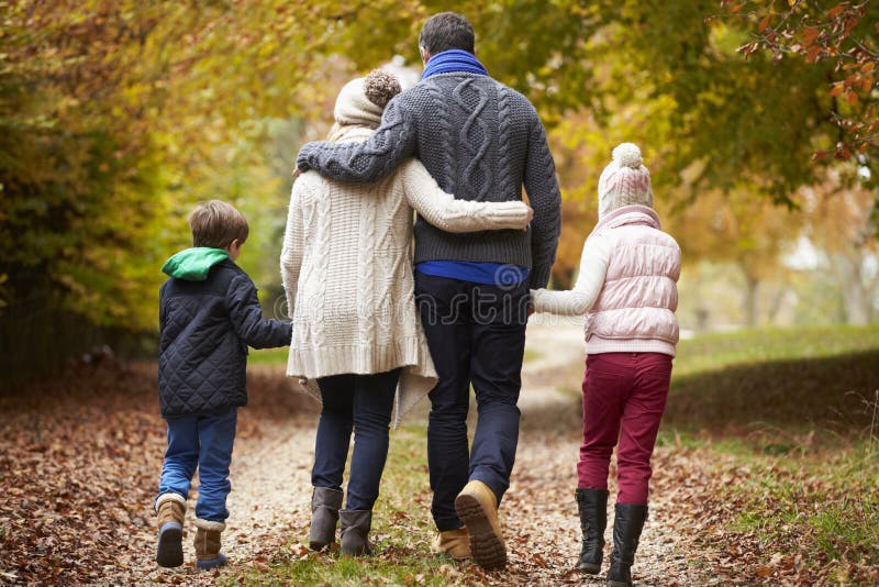 Rear View of Family Walking Along Autumn Path Stock Image - Image of ...