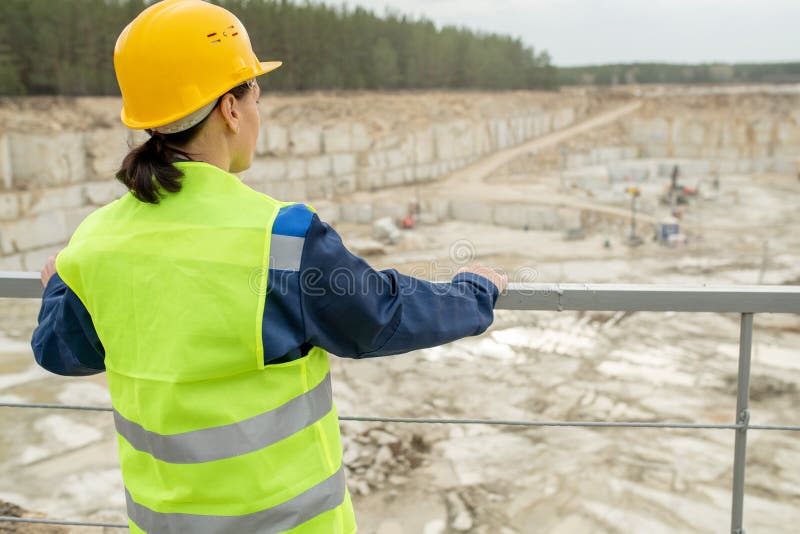 Rear View of Female Engineer Looking at Construction Site Stock Photo ...