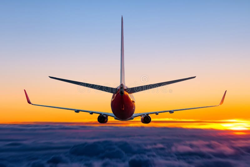 Rear View of a Flying Passenger Jetliner in the Sunset Sky Stock Image ...