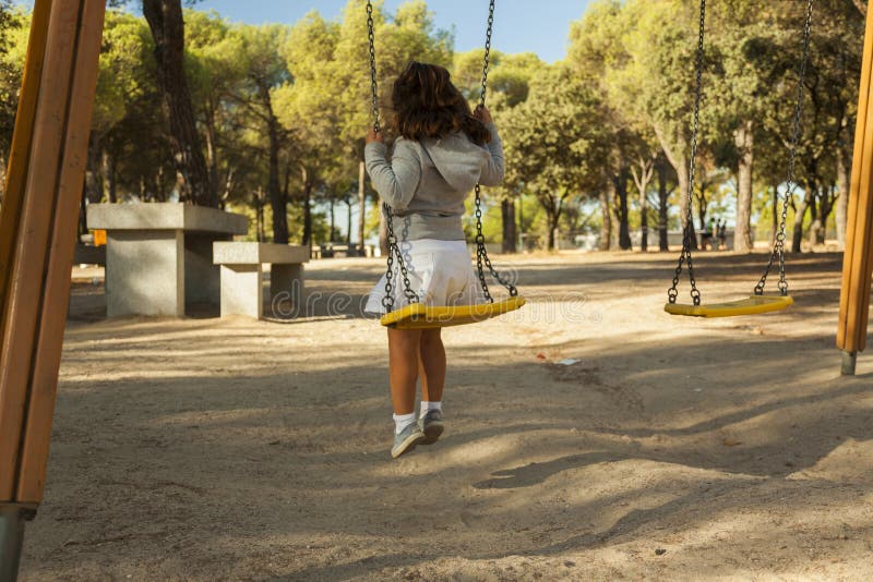 Rear View Girl Having Fun on Swing at the Playground Stock Image ...