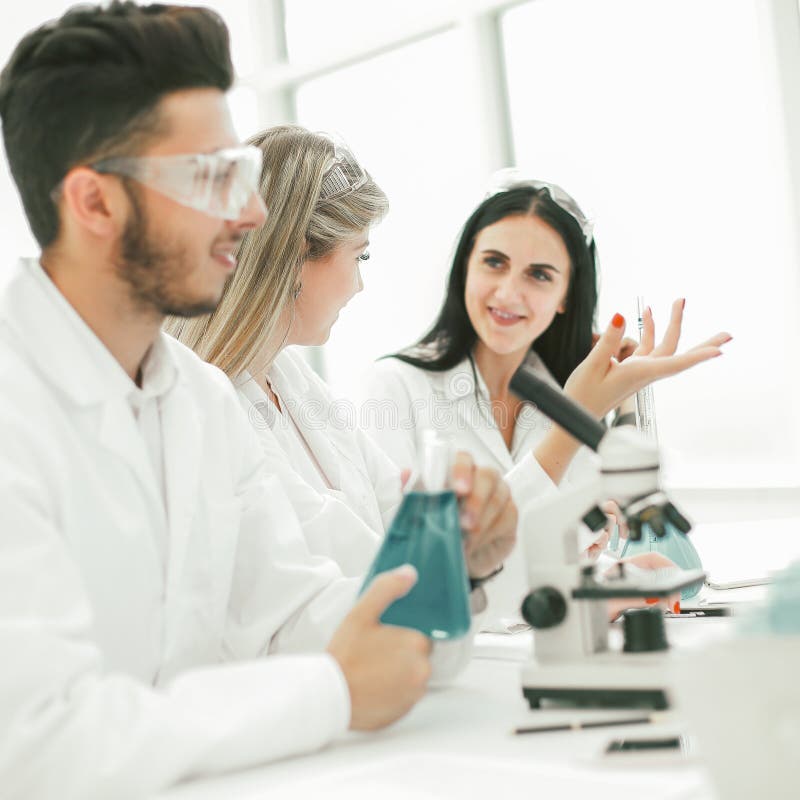Rear View.a Group of Scientists Working in a Modern Laboratory Stock ...