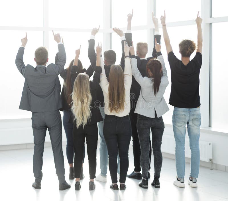 Rear View. Groups of Young Business People Pointing Up Stock Image ...