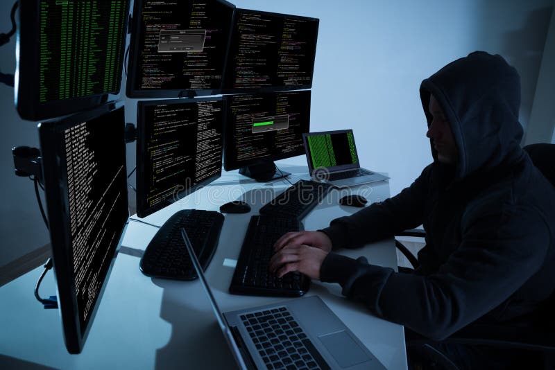 Hacker Using Multiple Computers To Steal Data Stock Photo - Image of ...