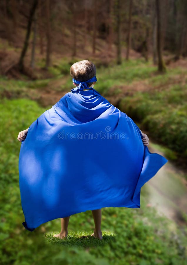 Rear View of Kid in Blue Cape Standing in Field Stock Image - Image of ...