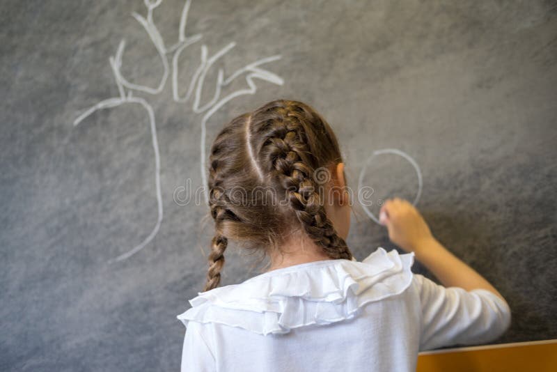 Elementary Student Drawing on Blackboard Stock Image - Image of ...