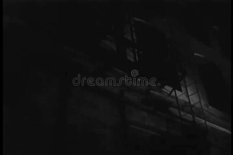 Rear View of Man Climbing Down Fire Escape at Night Stock Footage ...