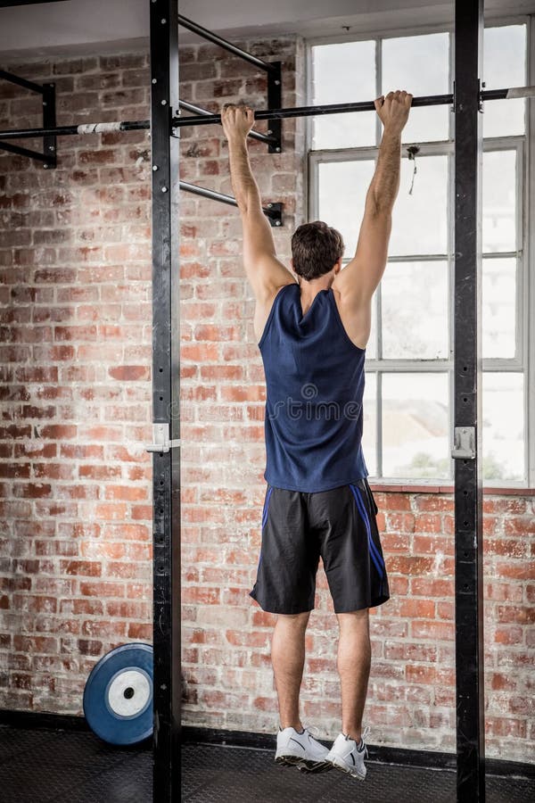 Rear View of Man Doing Pull Ups Stock Photo - Image of bodybuilding ...