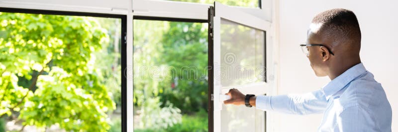 Rear View of a Man Opening Window Stock Image - Image of sunlight ...