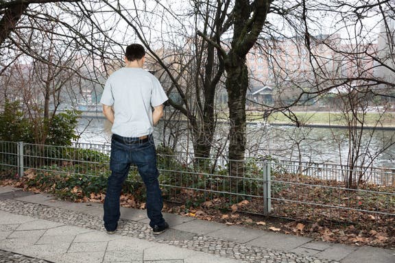 Man Peeing Outside stock image. Image of urinate, male - 218371373