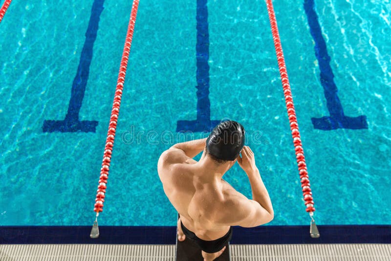 Rear View of a Man Preparing Swimming Goggles Stock Photo - Image of ...