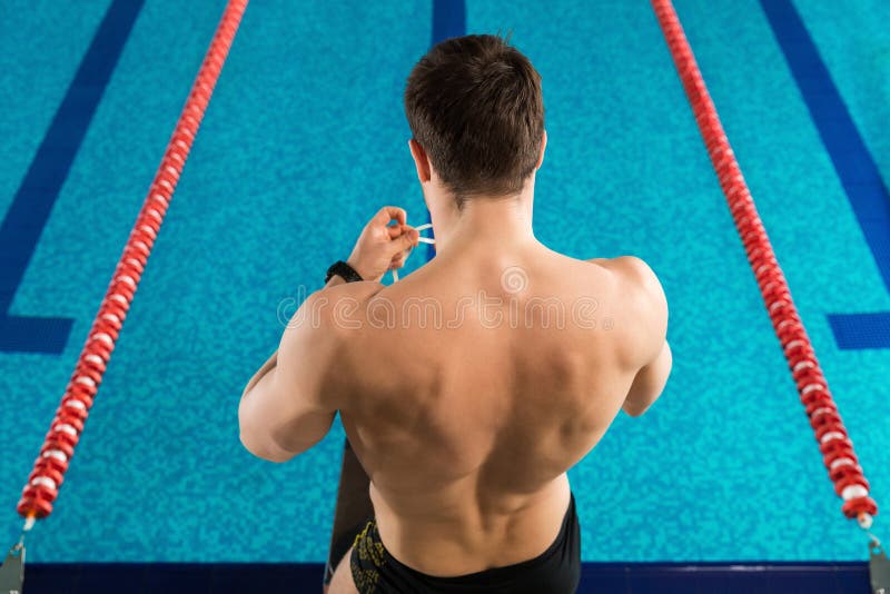 Rear View of a Man Preparing Swimming Goggles Stock Photo - Image of ...