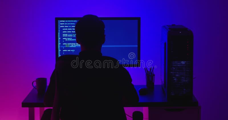 Programmer Coding On A Computer In The Dark With A View Of The Lights 3682