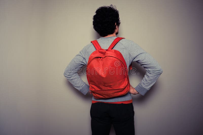 Rear View Of A Man Wearing A Backpack Stock Image - Image of people ...