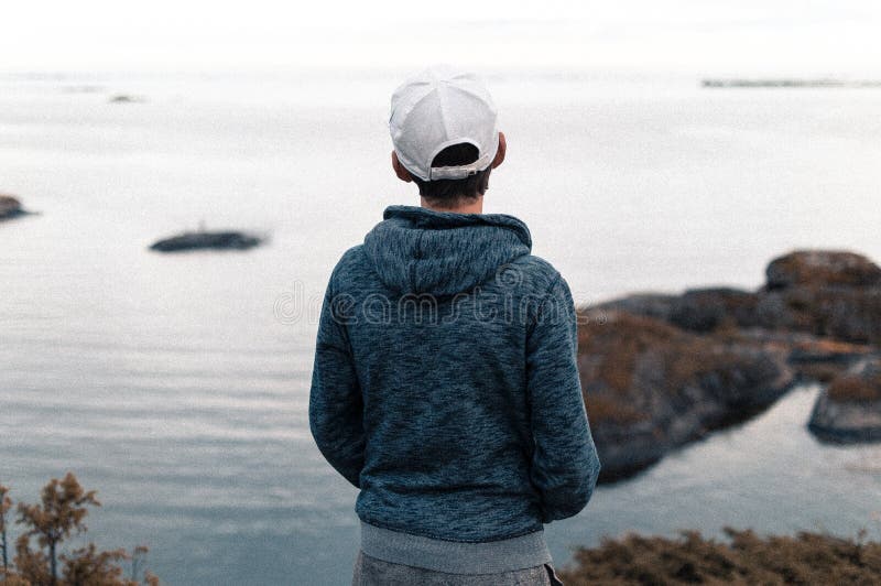 Rear View of a Man Standing on Beach Stock Photo - Image of water ...